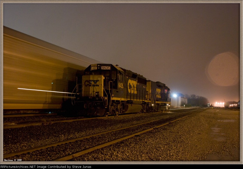 CSX 6435,2210 sit on the old main as Q237 goes south